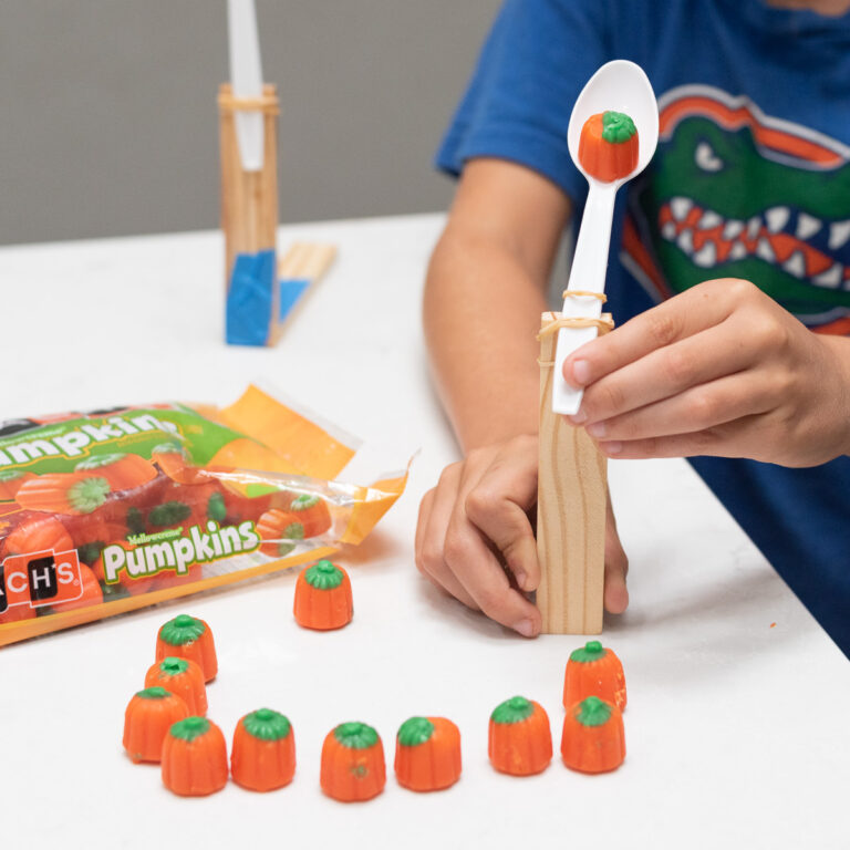 Candy Pumpkin Catapult - Easy Halloween STEM Activity for Kids!